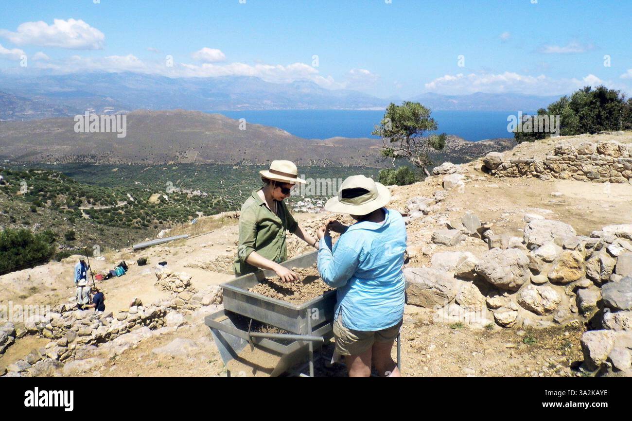 June 4, 2014 - Crete, GRC - Two archaeology students sift through dirt ...