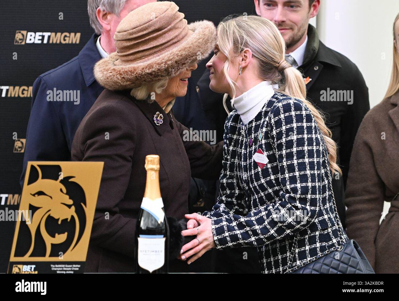 Queen Camilla (left) speaks with Charlotte Giles, girlfriend of the ...