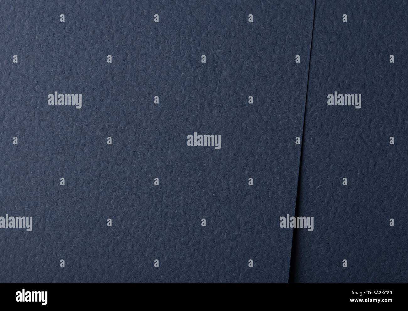 Navy blue paper background with a matte texture and rough grain. Deep ...