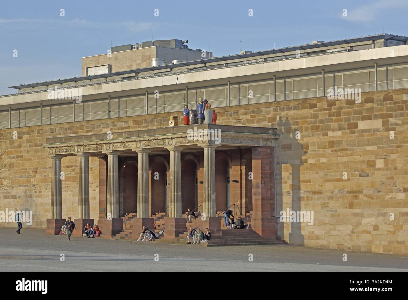 Portico with columns at the Red Palace built in 1826 and pedestrians ...