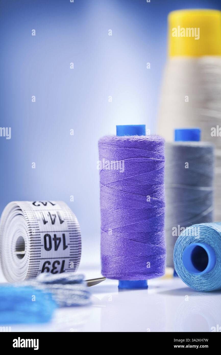 Sewing threads and roll of tape Stock Photo - Alamy