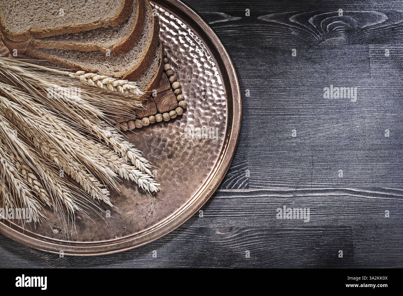 Rye wheat ears slices of fresh-baked bread vintage copper tray food and ...