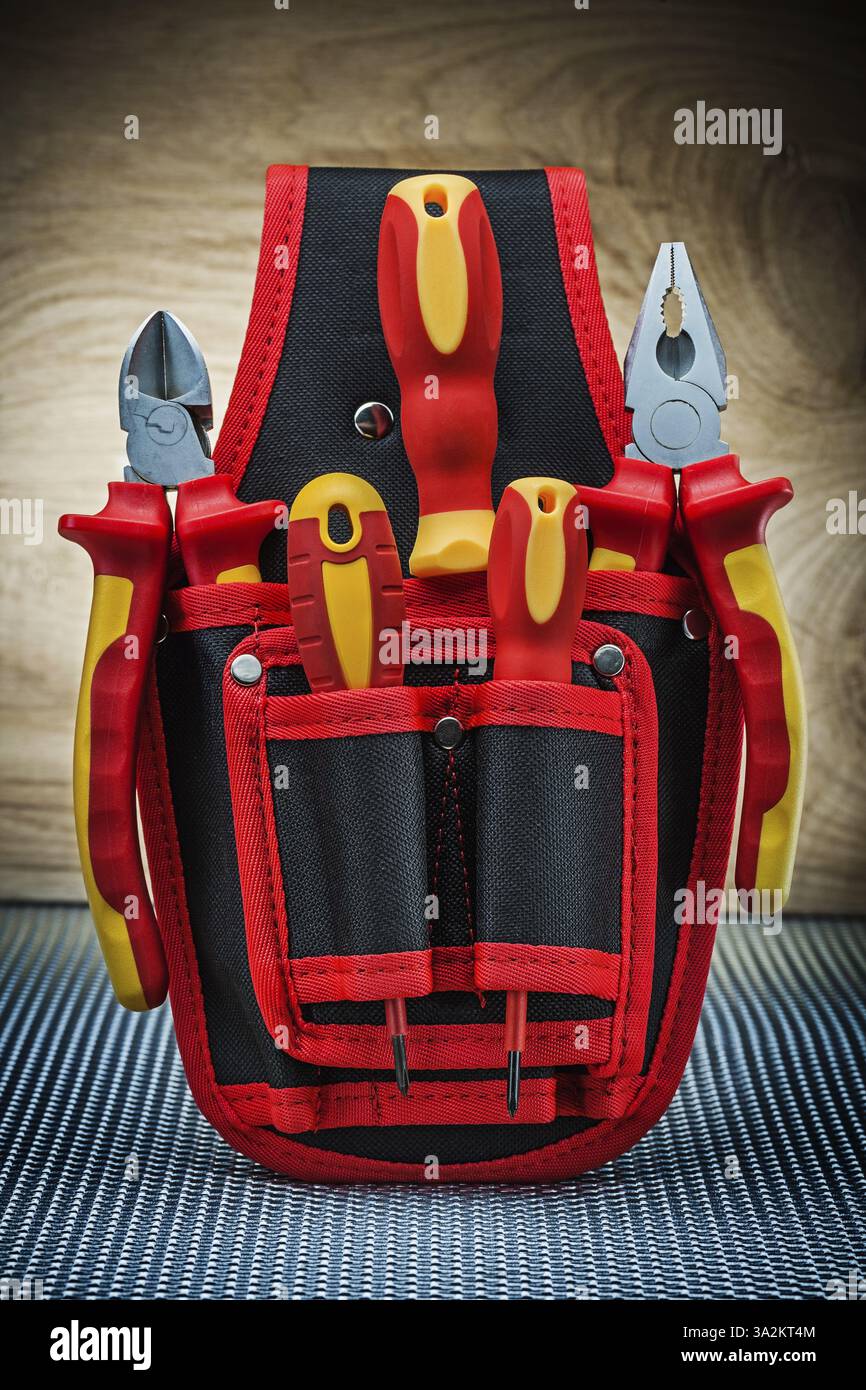 Small black and red construction toolbelt with tools Stock Photo - Alamy