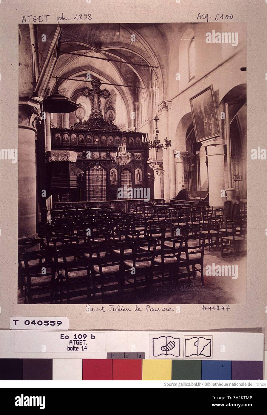 A detailed photograph by Eugène Atget showing the façade of L'Église ...