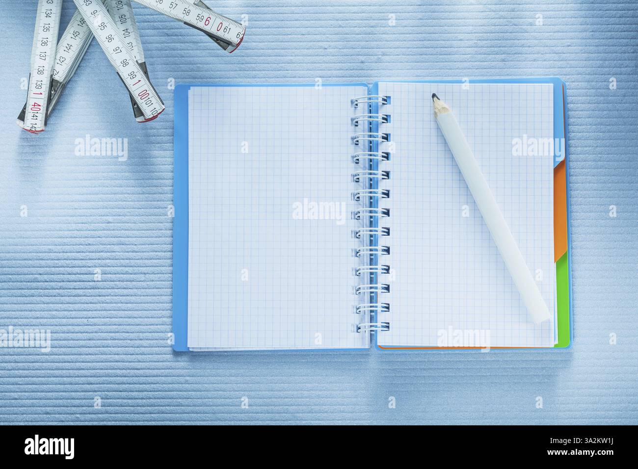 Spiral notepad pencil measuring tape construction concept Stock Photo ...