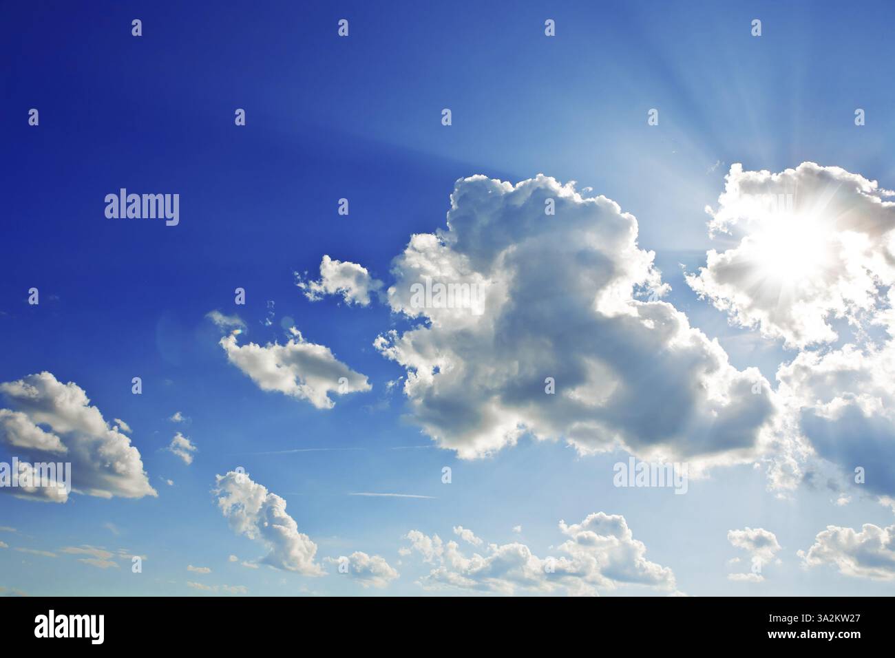 Sun looks out from for clouds Stock Photo - Alamy