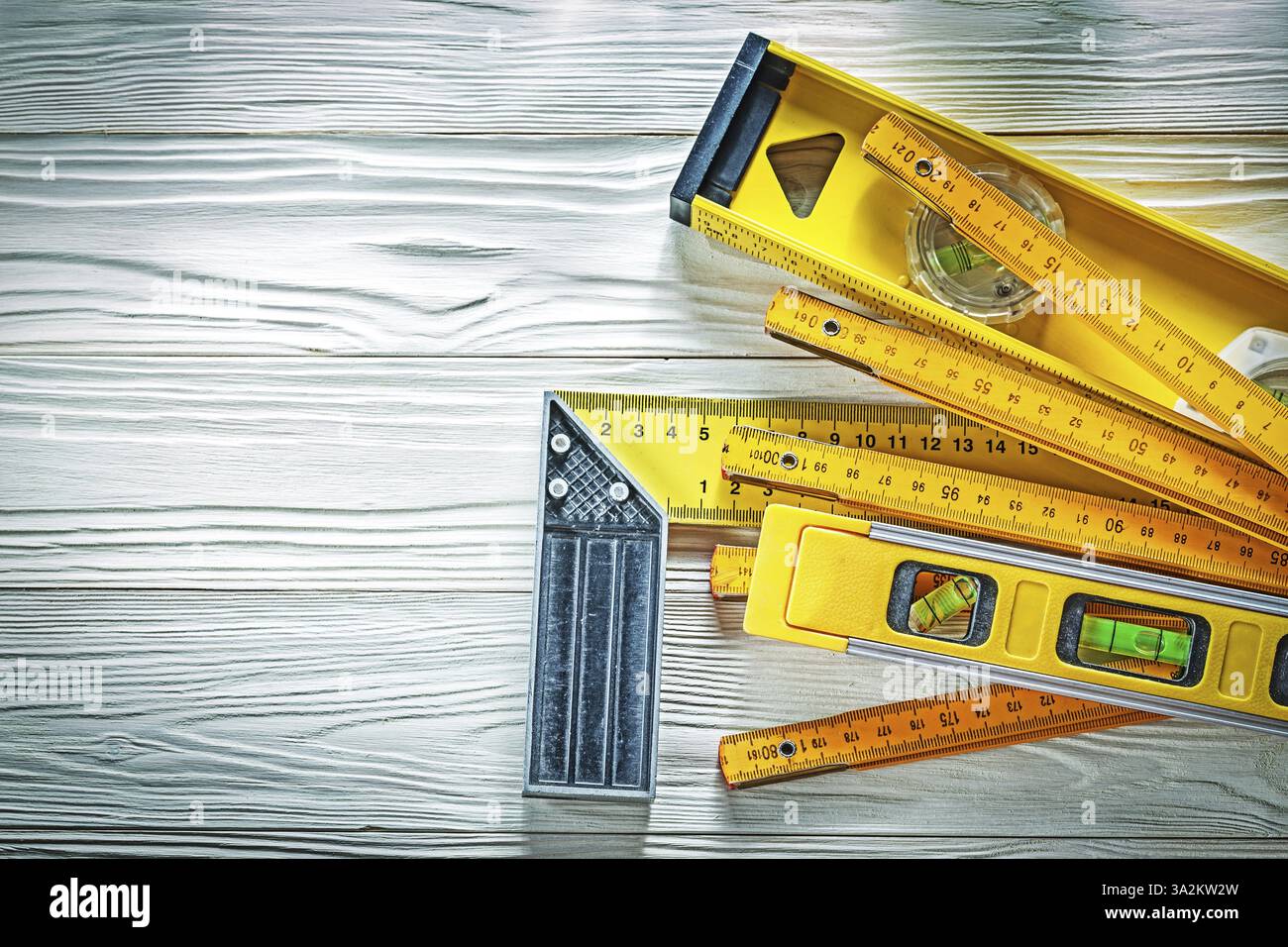 Wooden meter construction level square ruler on white board Stock Photo ...