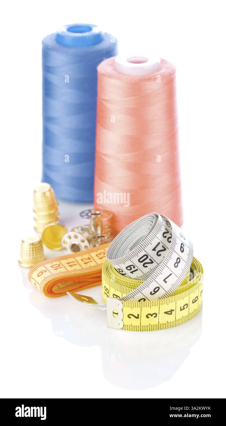 Threads and tapelines with spools and timbles Stock Photo - Alamy