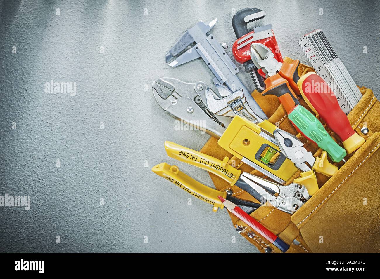 Set of construction tooling in tool belt Stock Photo - Alamy