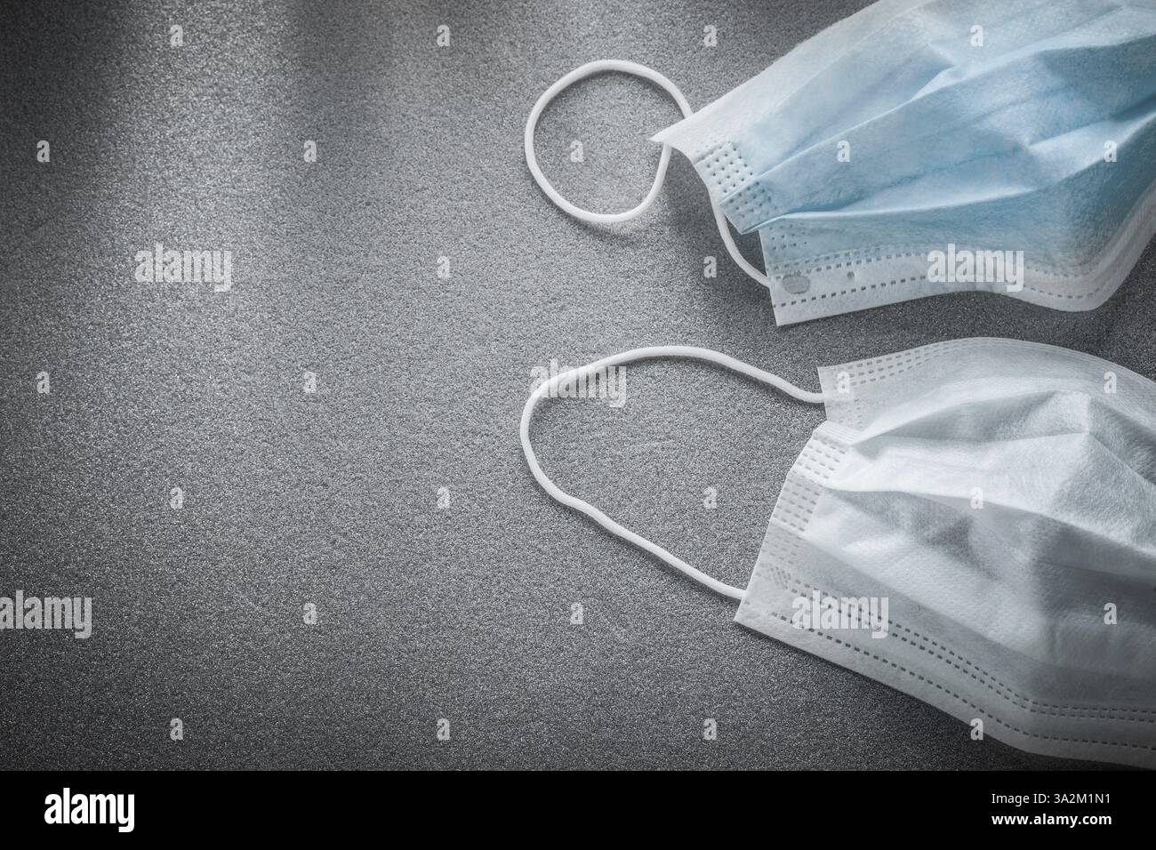 Sterile flu masks on grey background Stock Photo - Alamy
