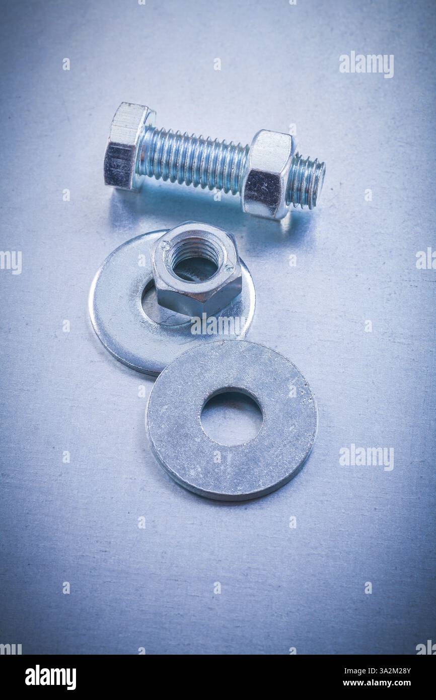 Screwbolt bolt washers and screw nuts on metallic background ...