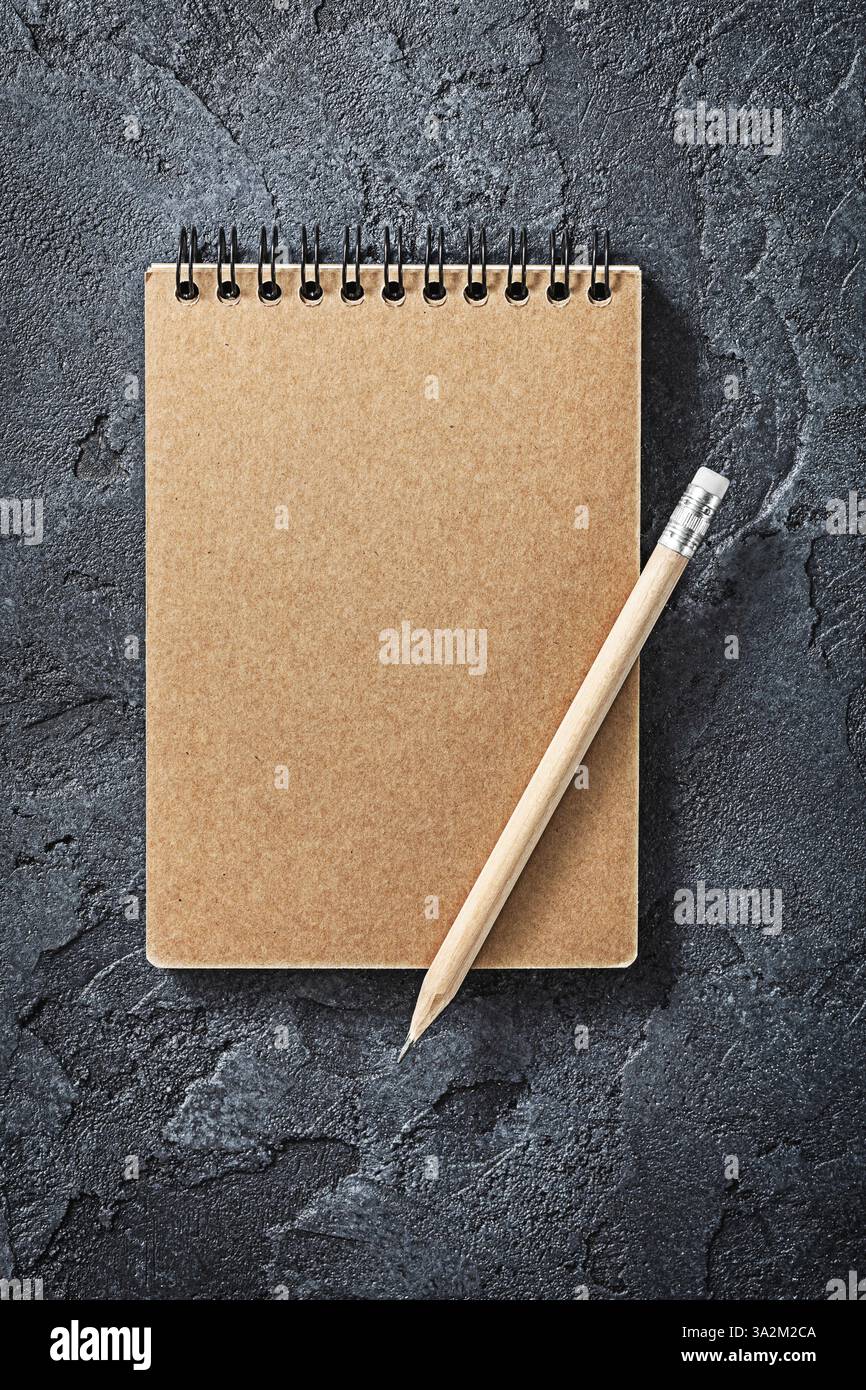 Wooden Pencil On Opened Notepad Black Stone Background Stock Photo - Alamy