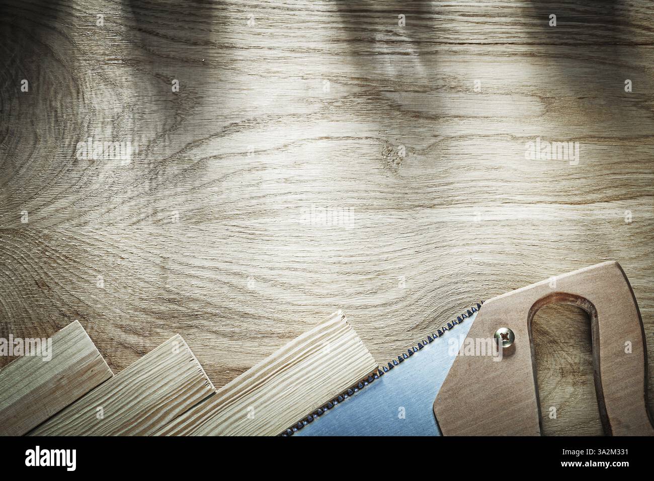 Stainless hacksaw timber on wood board construction concept Stock Photo ...