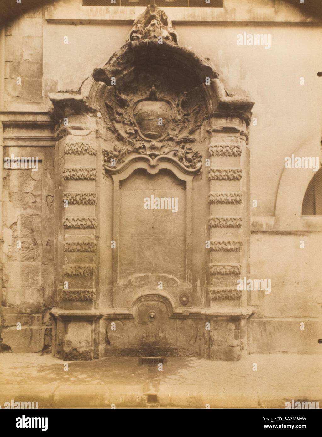 This photograph by Eugène Atget captures a fountain located at 38 Rue ...