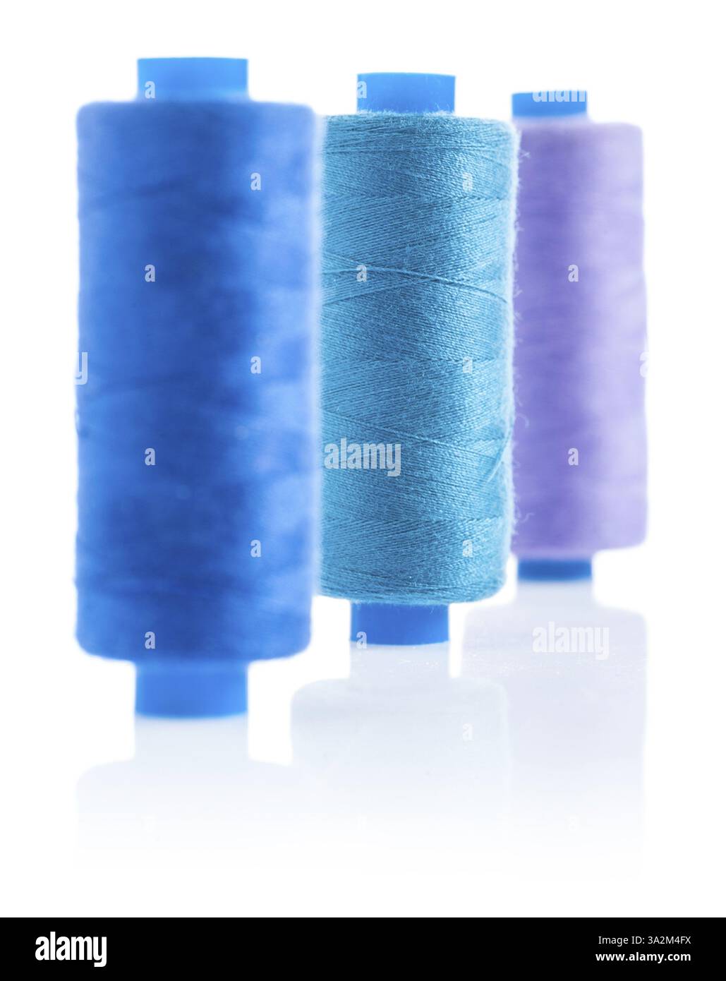Coloured threads on bobbins hi-res stock photography and images - Alamy