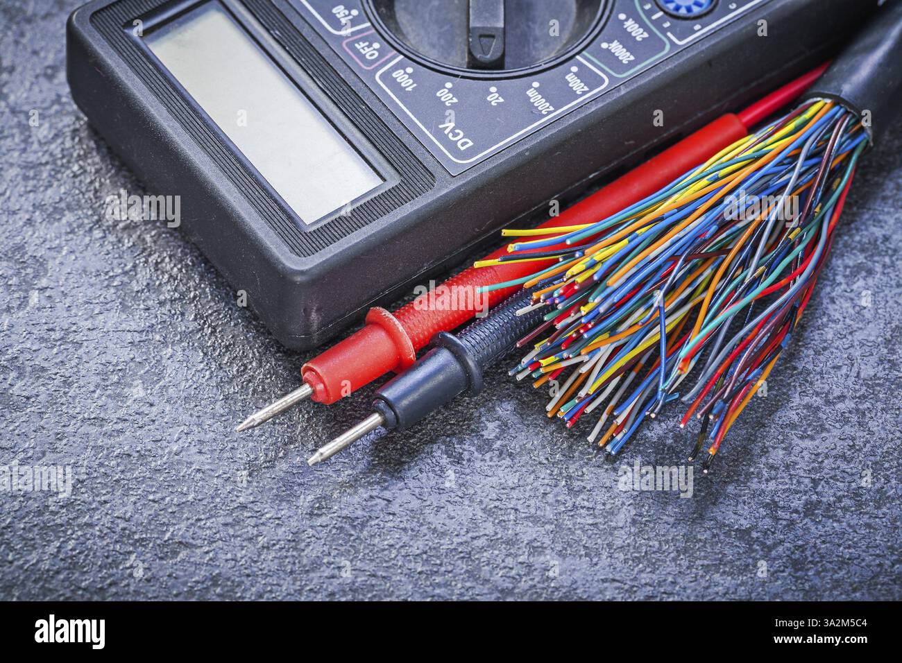 Set of digital multimeter electric tester wires on black background ...