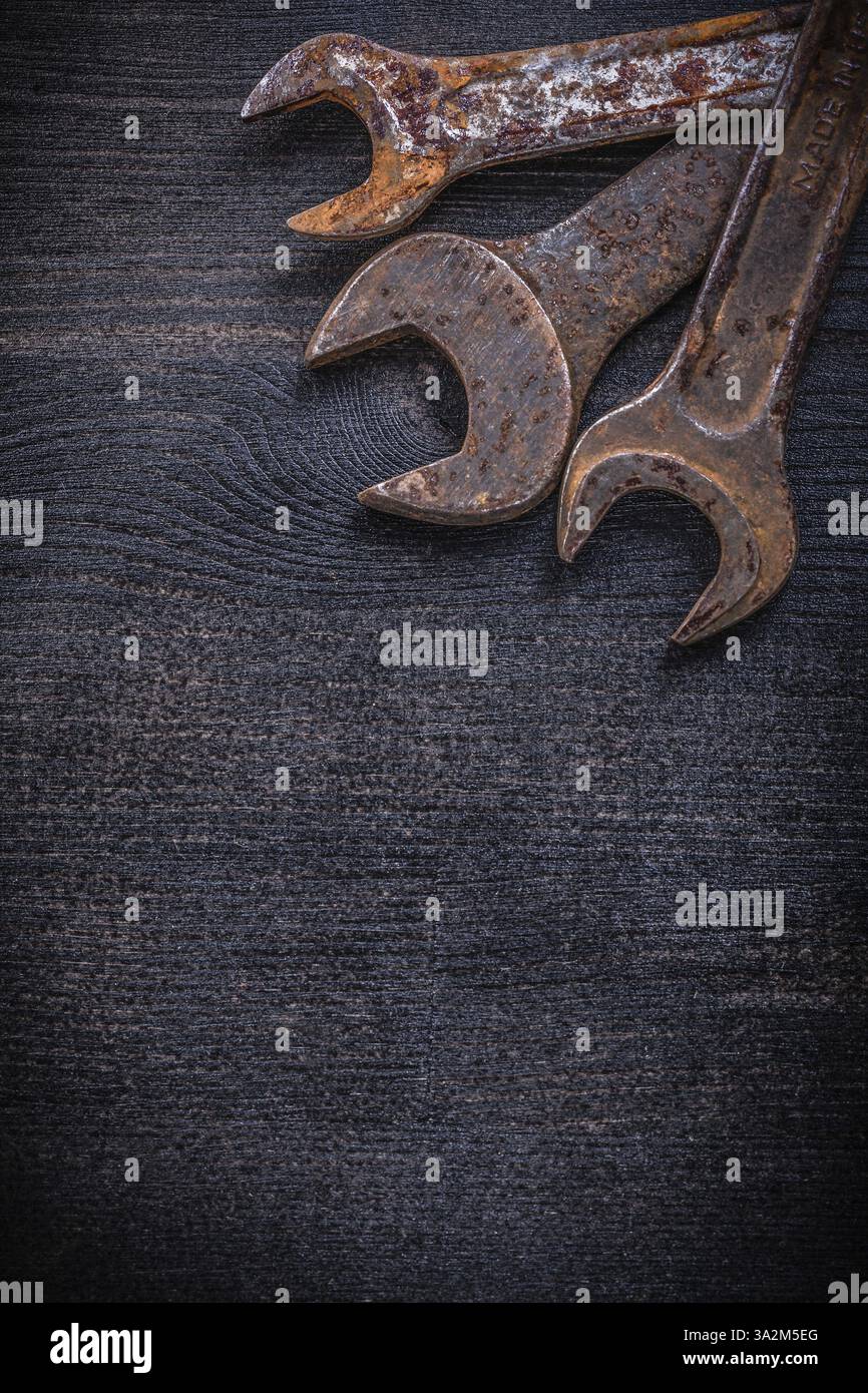 Set of grunge spanner wrenches on wood board construction concept Stock ...