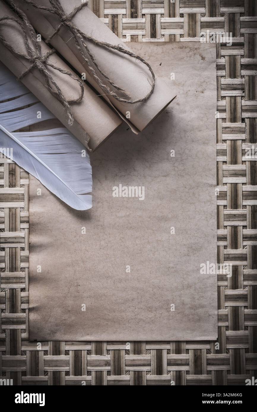 Set of vintage blank sheet corded paper rolls feather Stock Photo - Alamy