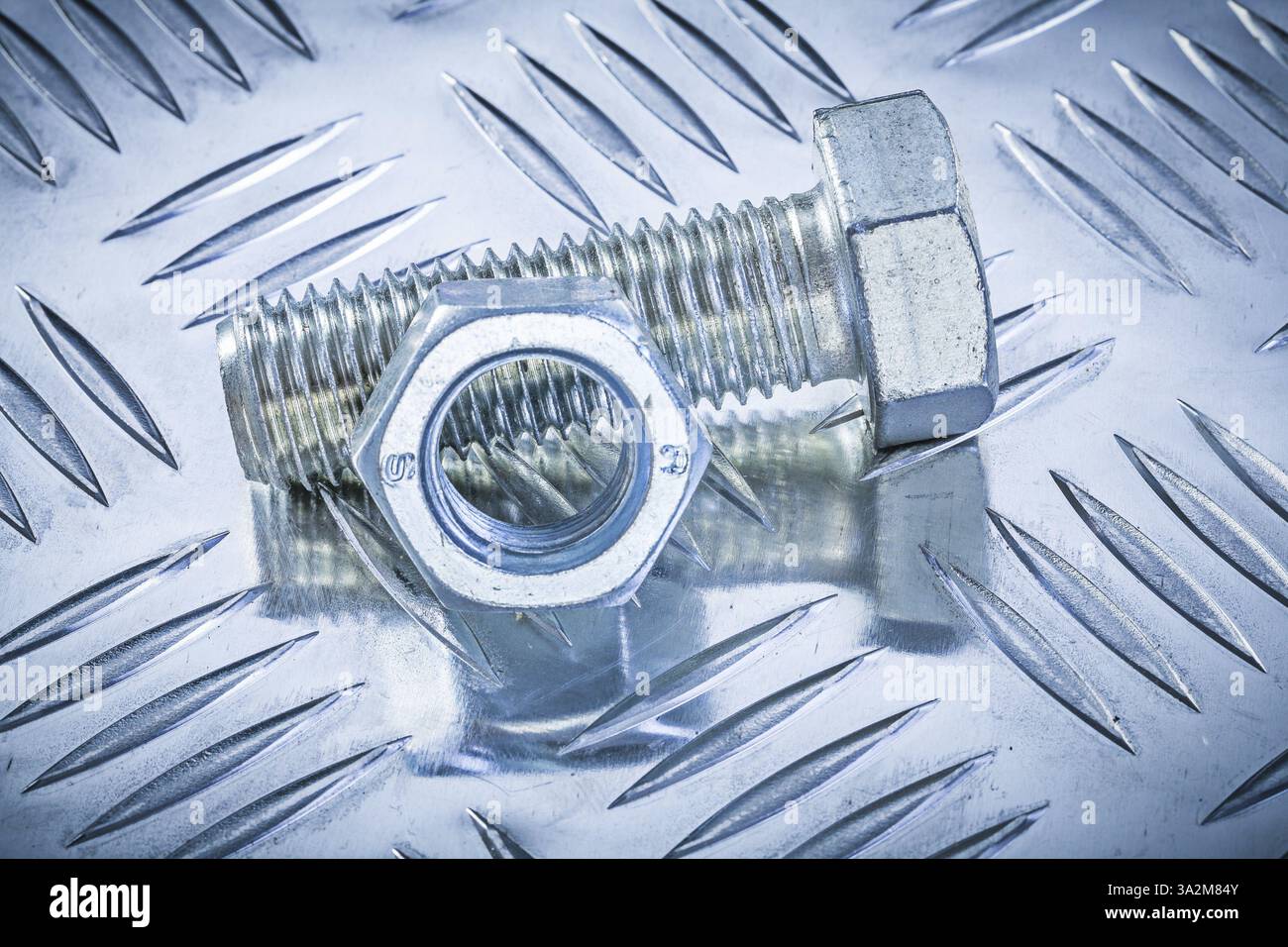 Stainless bolt detail threaded screw-nut on corrugated metal sheet ...