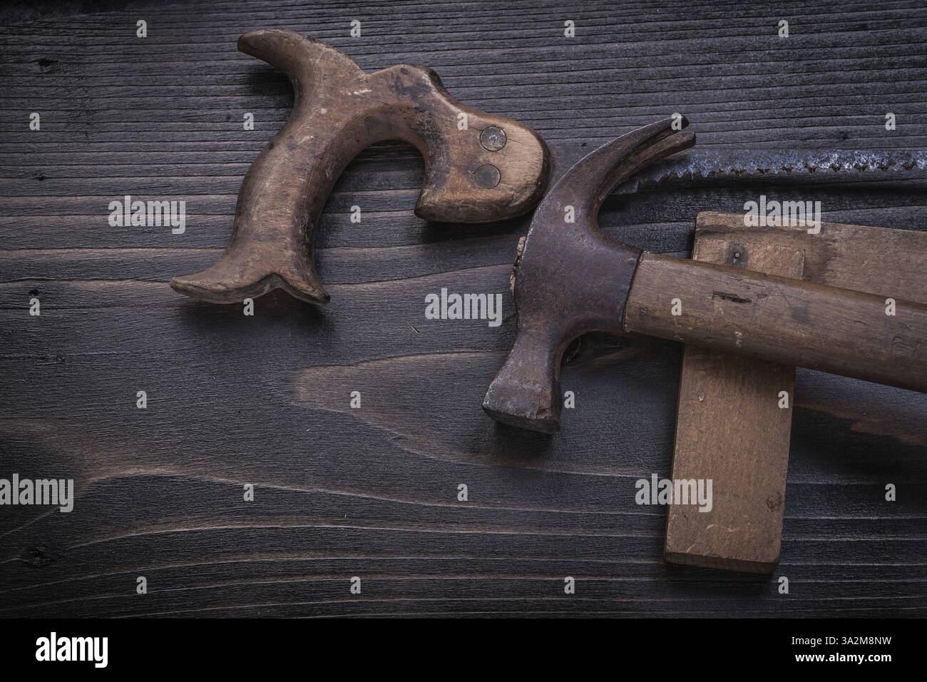 Set of vintage claw hammer square ruler and hand saw Stock Photo - Alamy