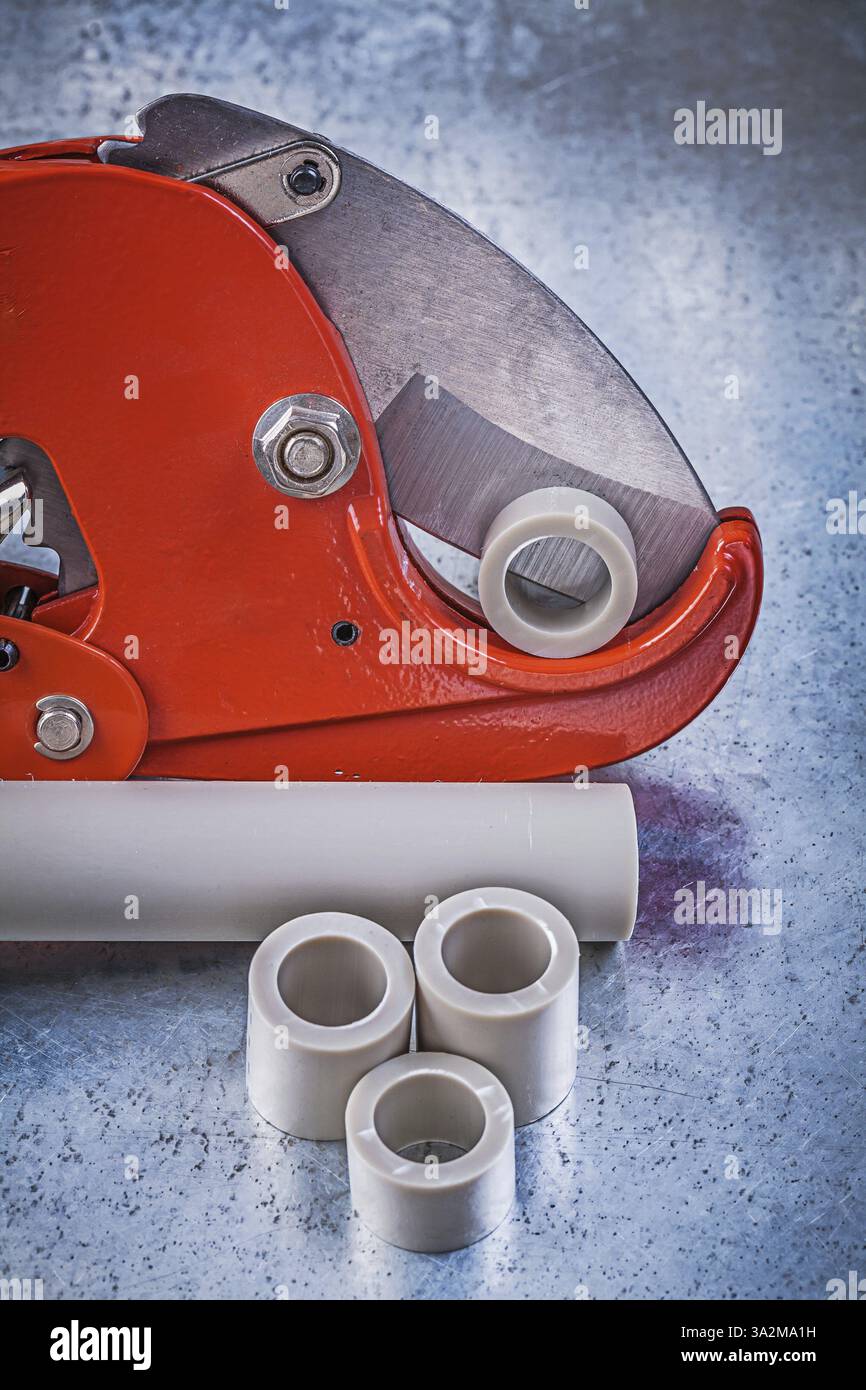Sharp pipe cutter water tubes on scratched metallic background ...