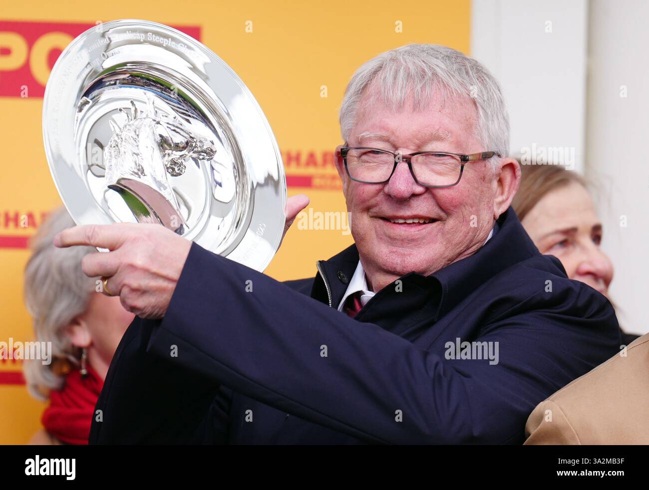 Sir Alex Ferguson celebrates after his horse Caldwell Potter won the ...