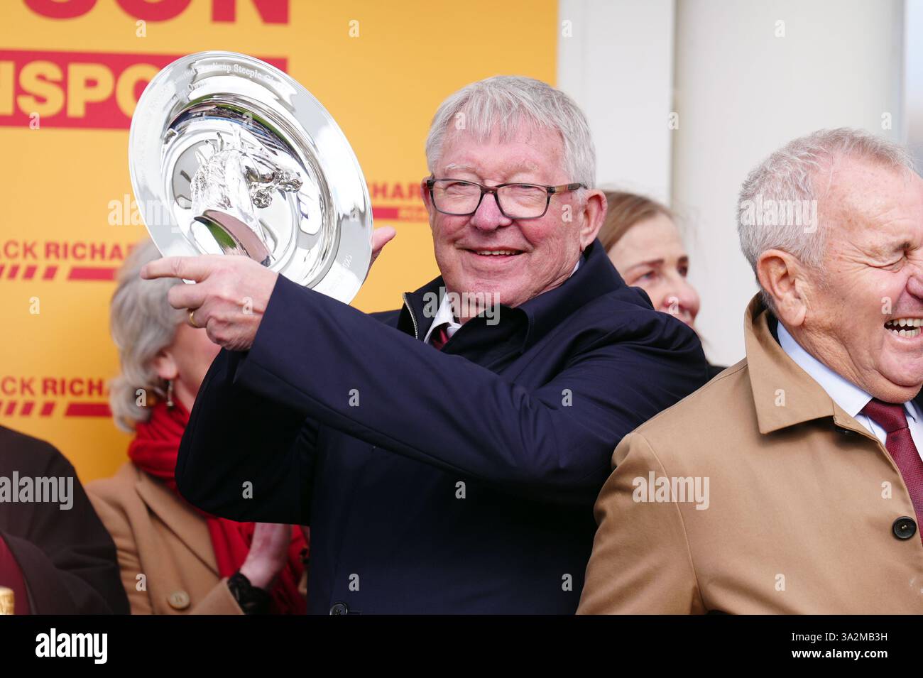 Sir Alex Ferguson celebrates after his horse Caldwell Potter won the ...
