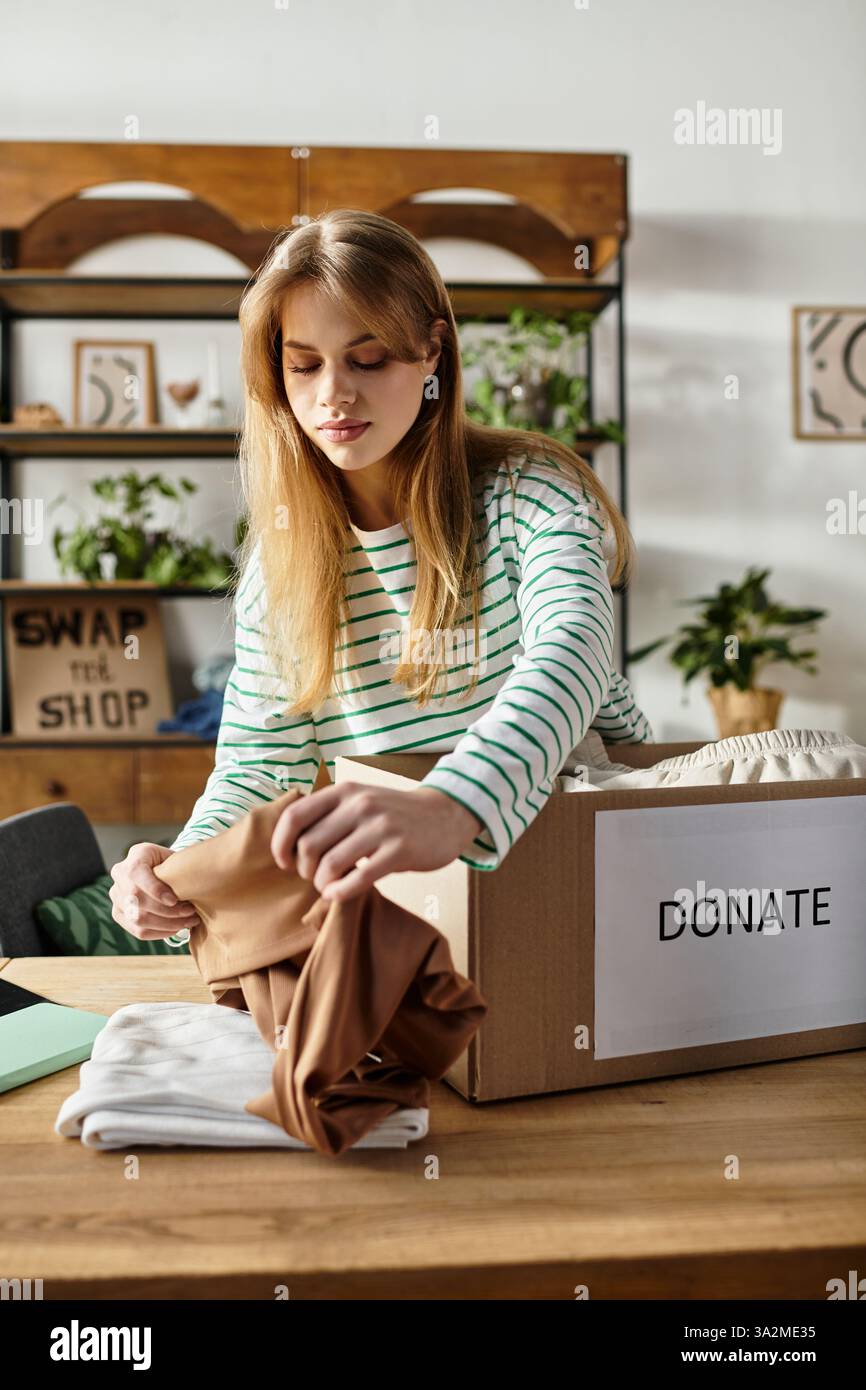 Woman organizing donations in charity hi-res stock photography and ...
