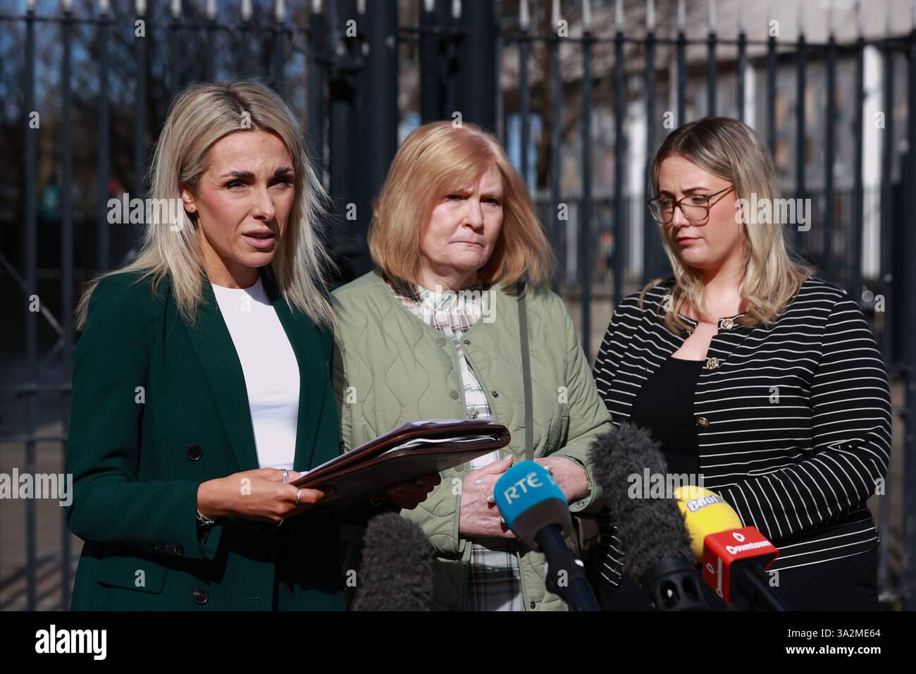 The foster mother (centre) (no name given) of Oliver Rowland, stands ...