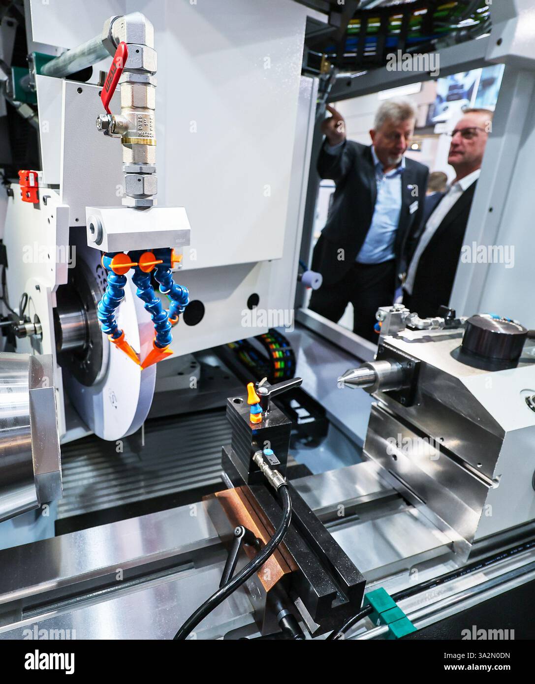 Leipzig, Germany. 13th Mar, 2025. An employee of machine manufacturer ...