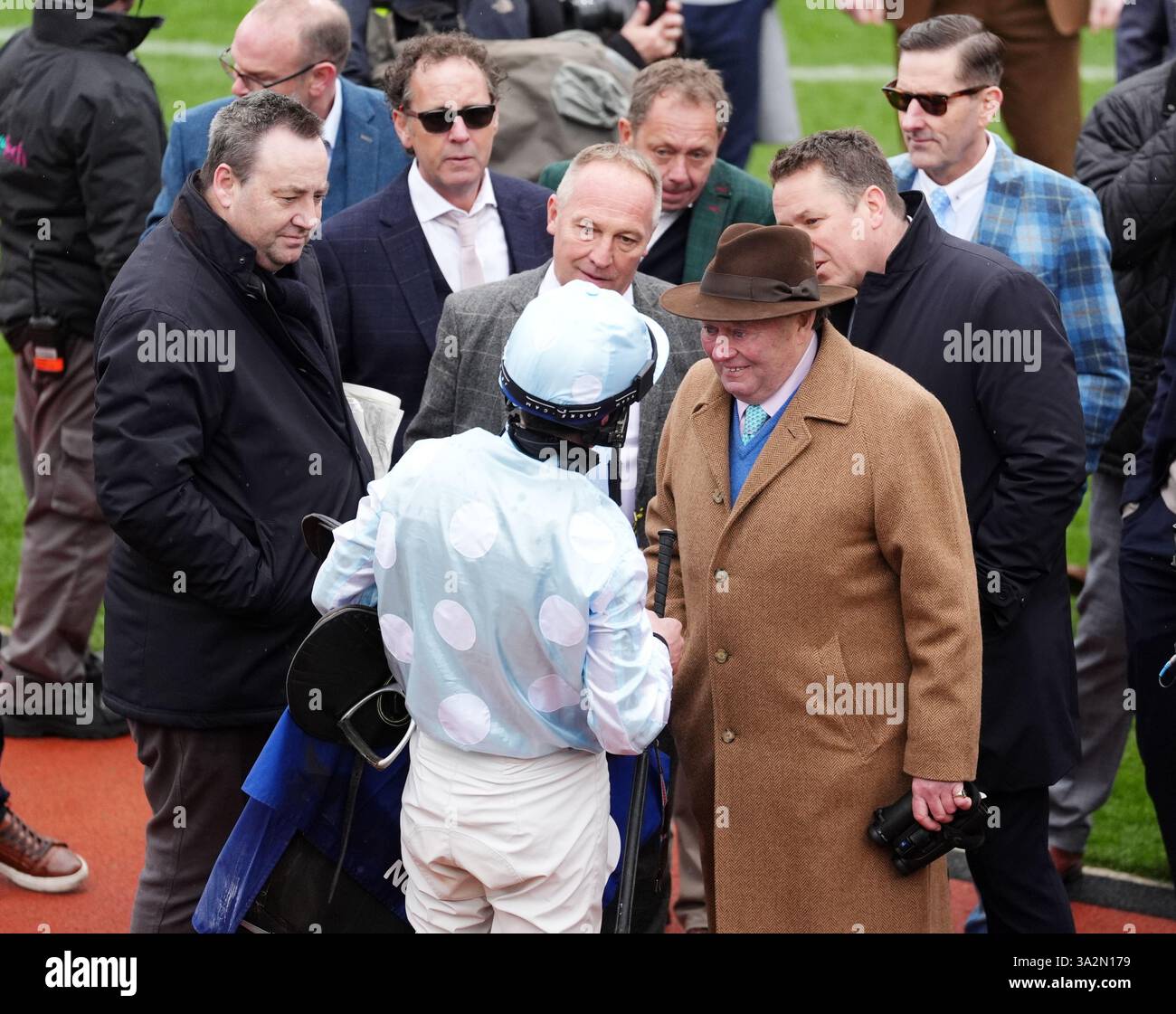 Trainer Nicky Henderson with jockey Brian Hughes after winning the ...