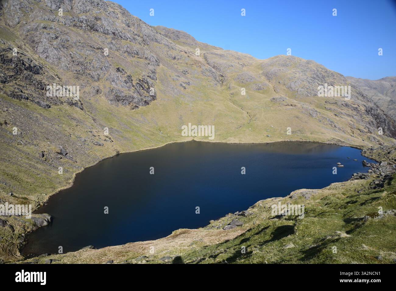 Low water tarn a gift from the glaciers Stock Photo - Alamy