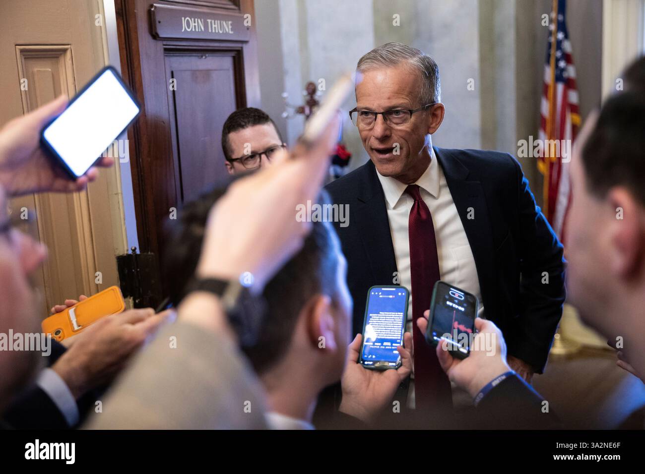 Senate Majority Leader John Thune (R-S.D.) speaks with reporters outside his office at the U.S ...