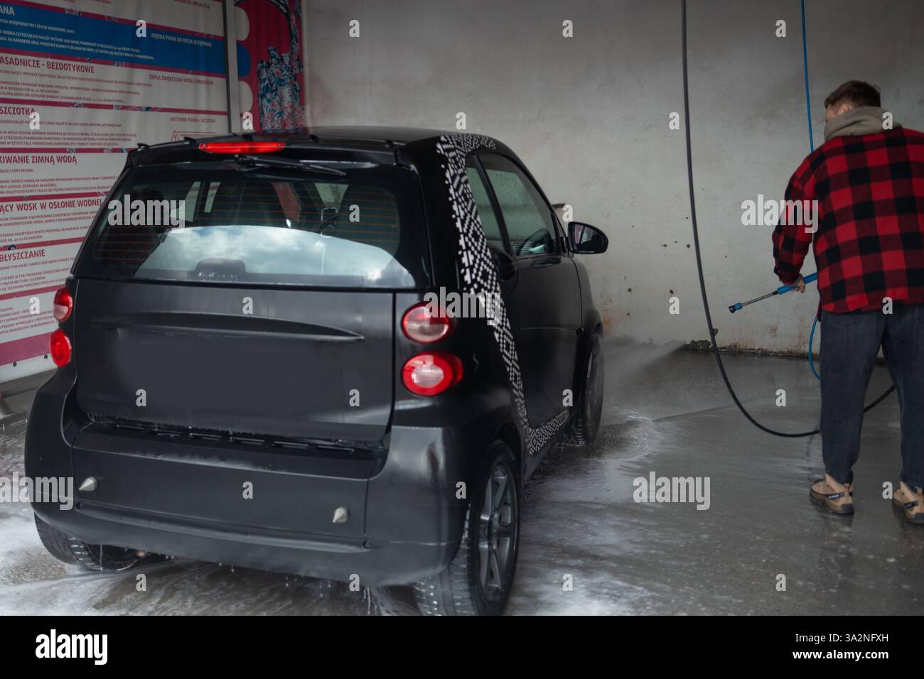 Washing rims at a manual car wash Stock Photo - Alamy