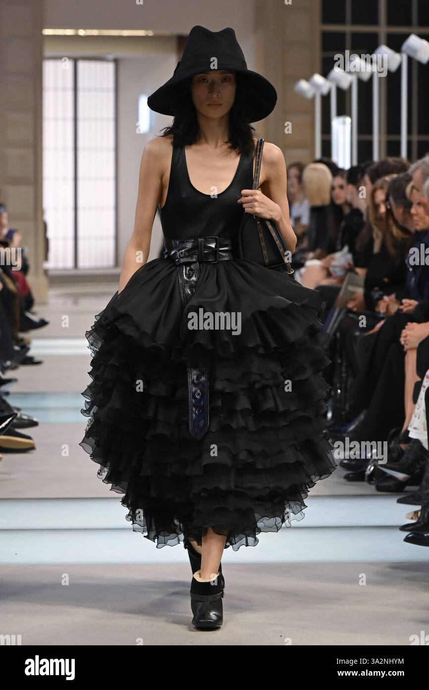 Model Chu Wong walks on the runway during the Louis Vuitton Ready to ...