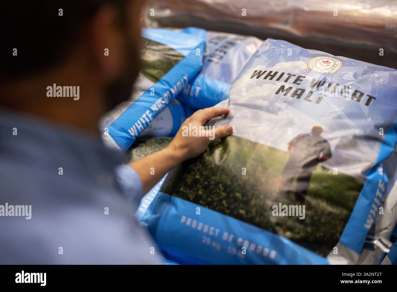 Jeff Ware, president of Resurgence Brewing Company, shows the malt they ...