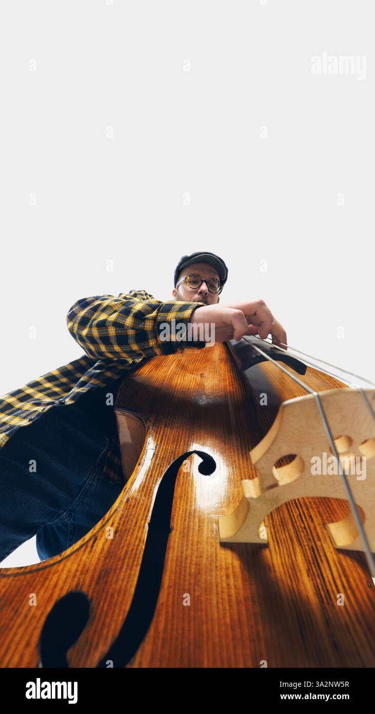 Low-angle image of dedicated bassist immersed in deep, soulful ...
