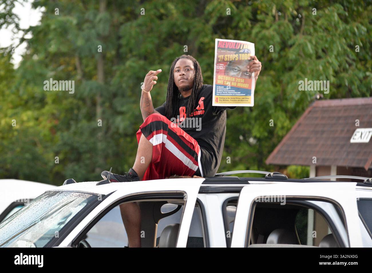 Aug. 11, 2014 - St. Louis, Missouri, U.S. - A male shows his ...