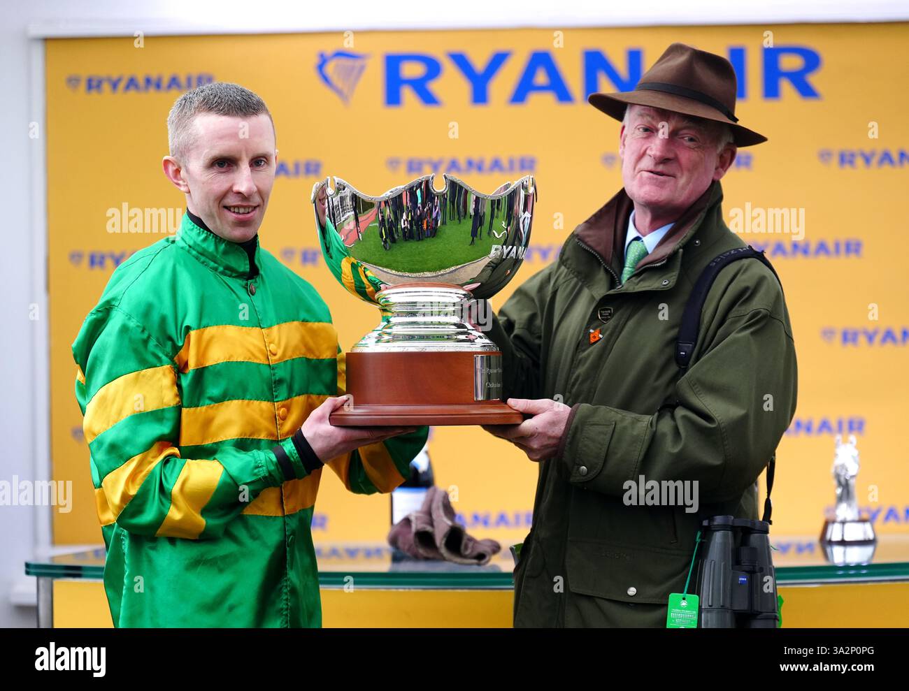 Trainer Willie Mullins with Mark Walsh with the trophy after Fact To ...