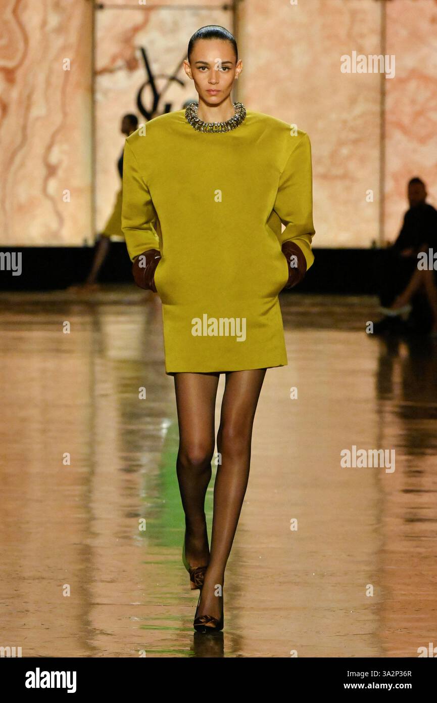 Model Binx Walton walks on the runway during the Saint Laurent Ready to ...