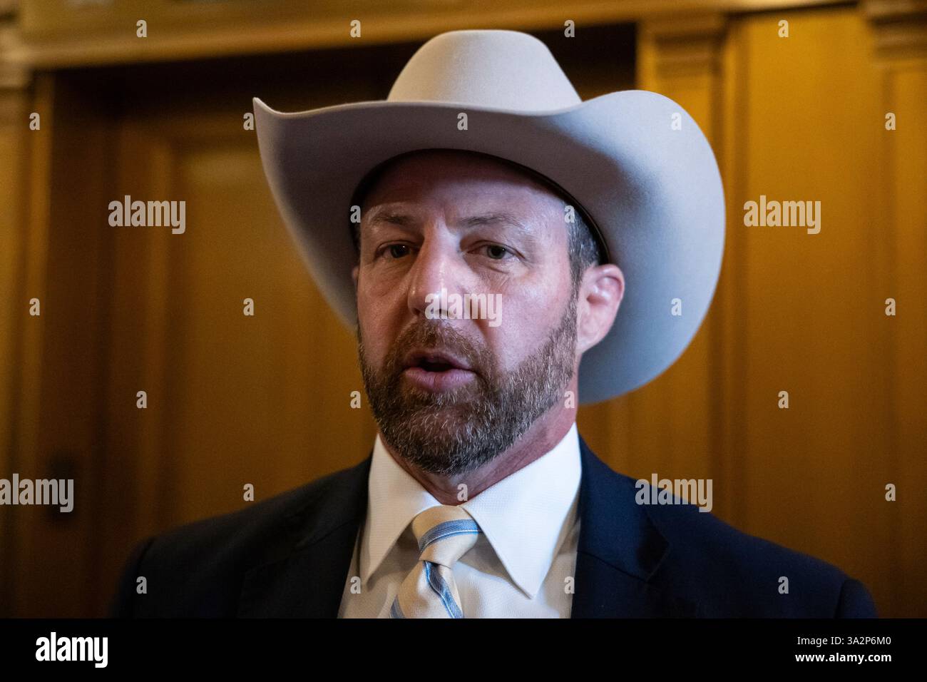 Sen. Markwayne Mullin (R-Okla.) wears a cowboy hat as he departs a vote ...