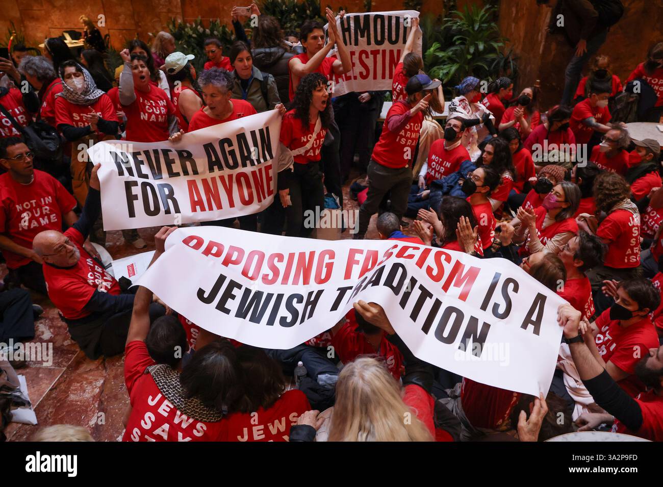 Demonstrators from the group, Jewish Voice for Peace, protest inside ...