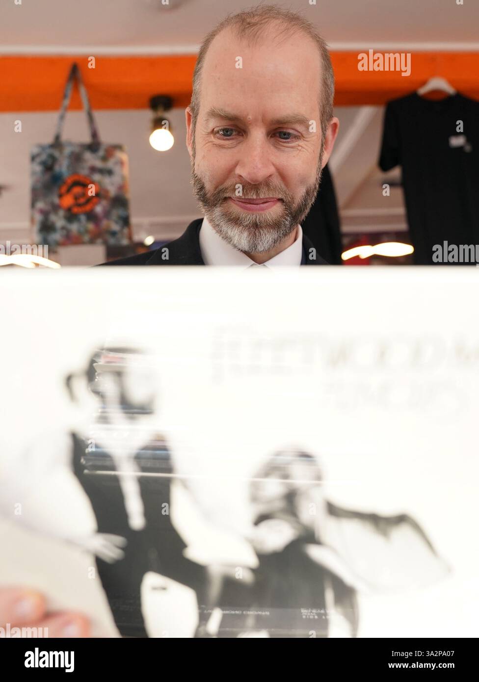 Business Secretary Jonathan Reynolds looks at a vinyl LP of Rumours by ...