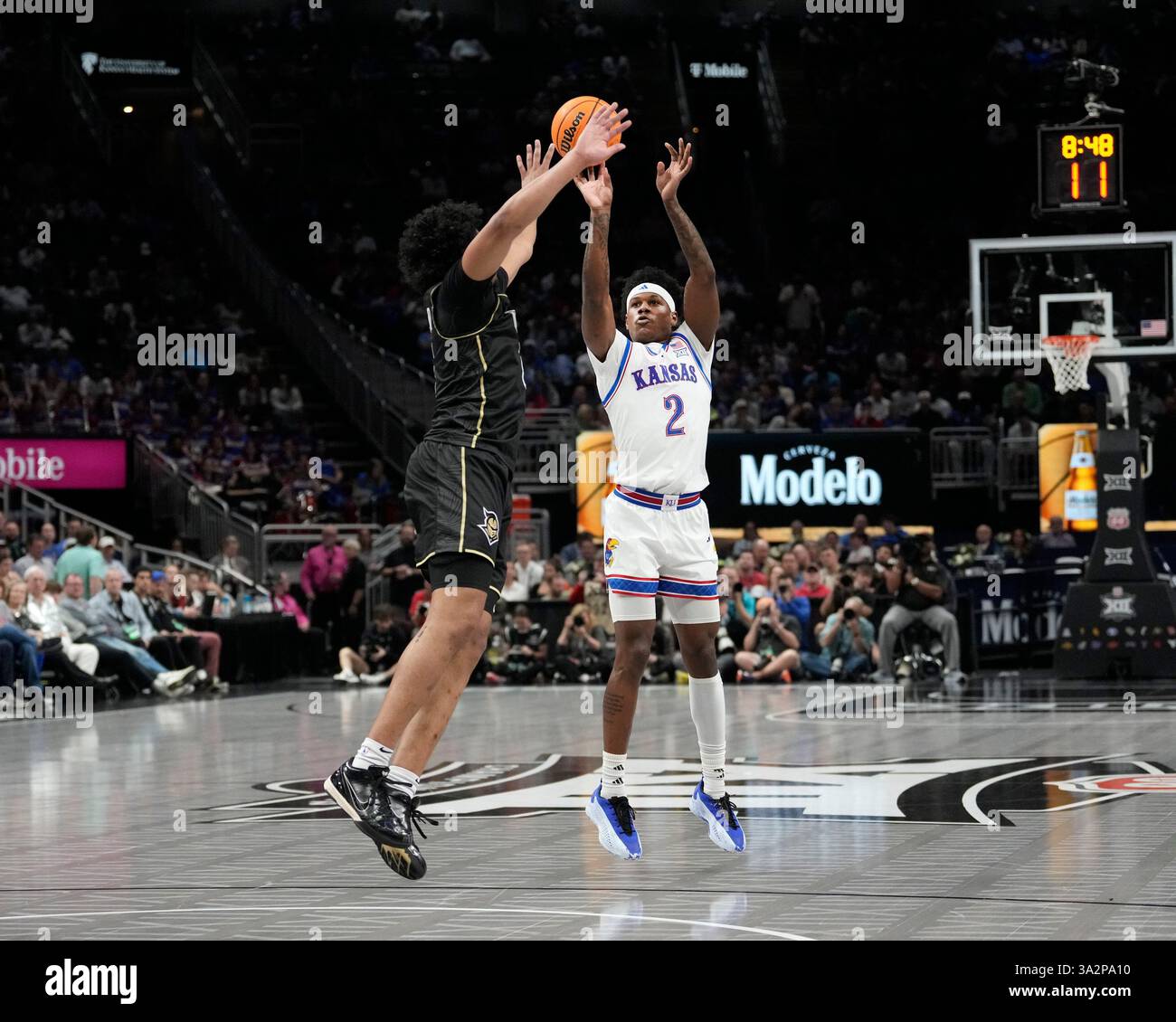 MAR 12 2025: Kansas Jayhawks guard AJ Storr (2) hits a three pointer ...