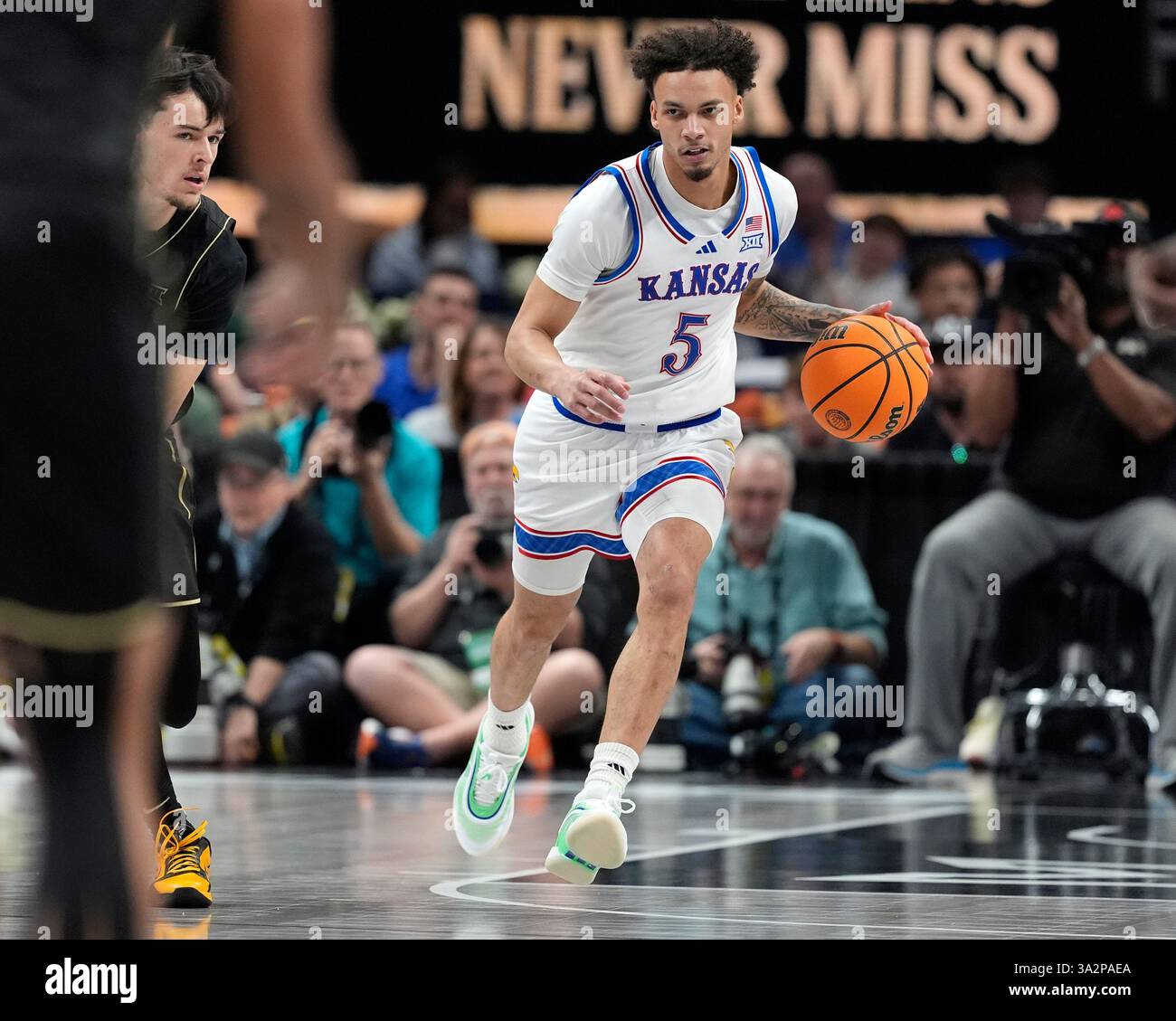 MAR 12 2025: Kansas Jayhawks guard Zeke Mayo (5) brings the ball up court against UCF in the Big ...