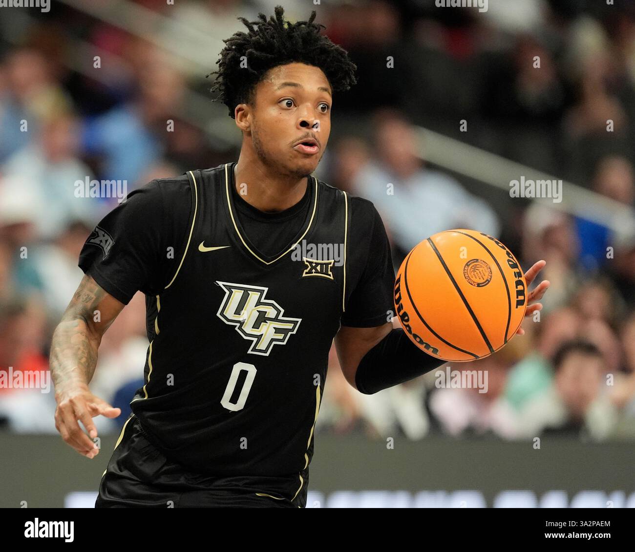 MAR 12 2025: UCF Knights guard Jordan Ivy-Curry (0) sets up a fake ...