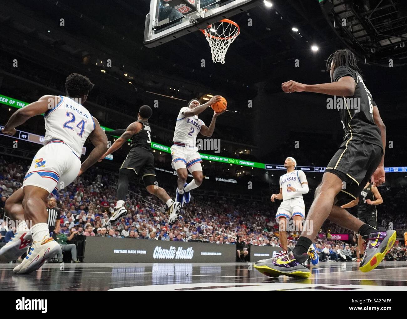 MAR 12 2025: Kansas Jayhawks guard AJ Storr (2) drives for a layup ...