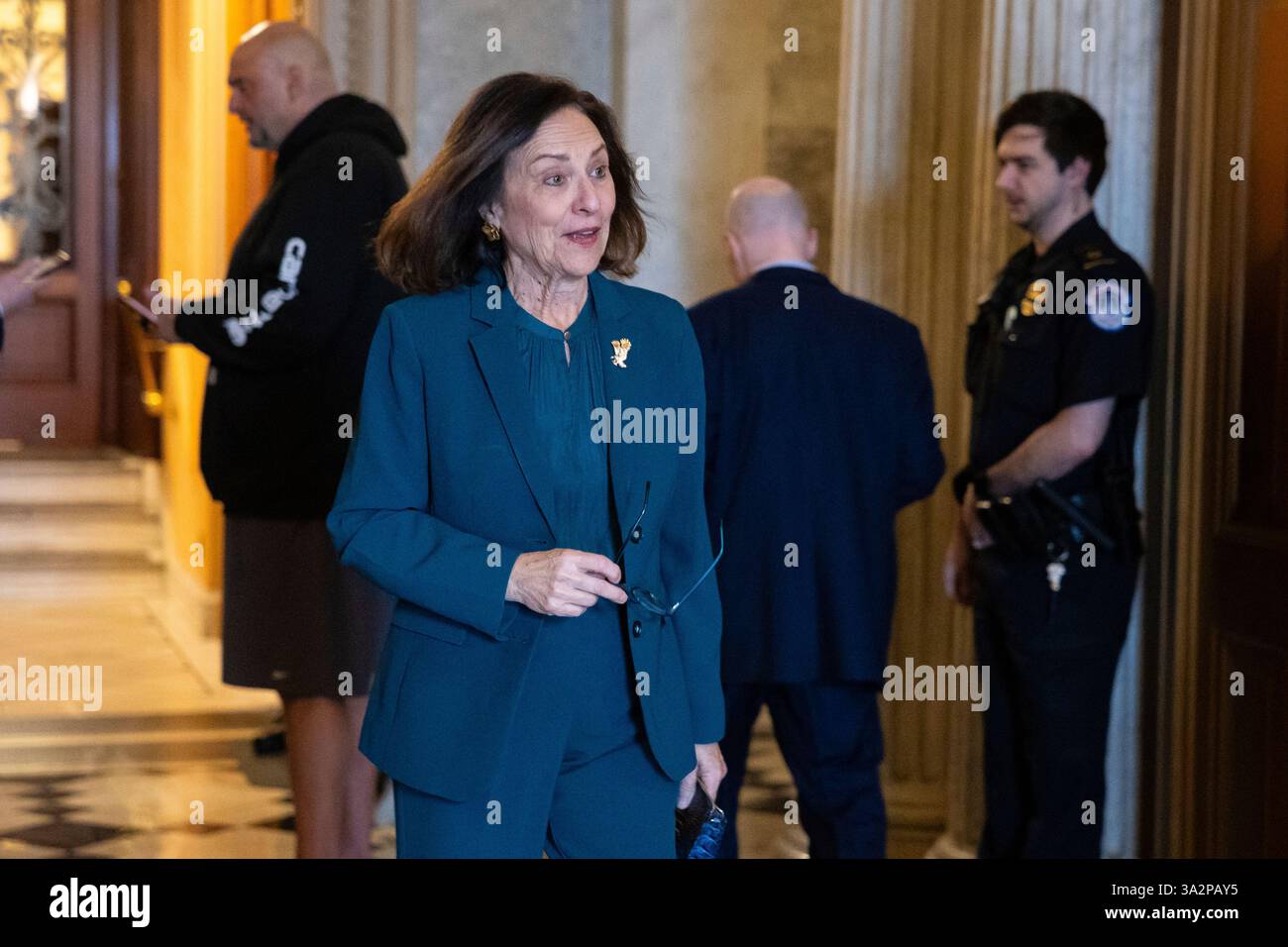 Sen. Deb Fischer (R-Neb.) departs a vote at the U.S. Capitol March 13 ...