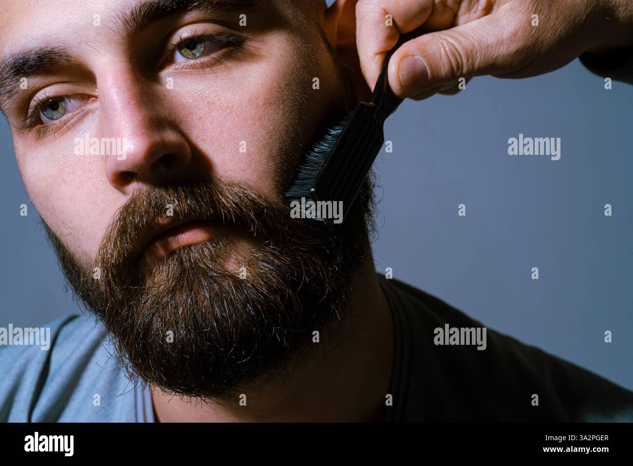 Man with barbers tools. Man cut hair with hairdressing scissors. Men ...