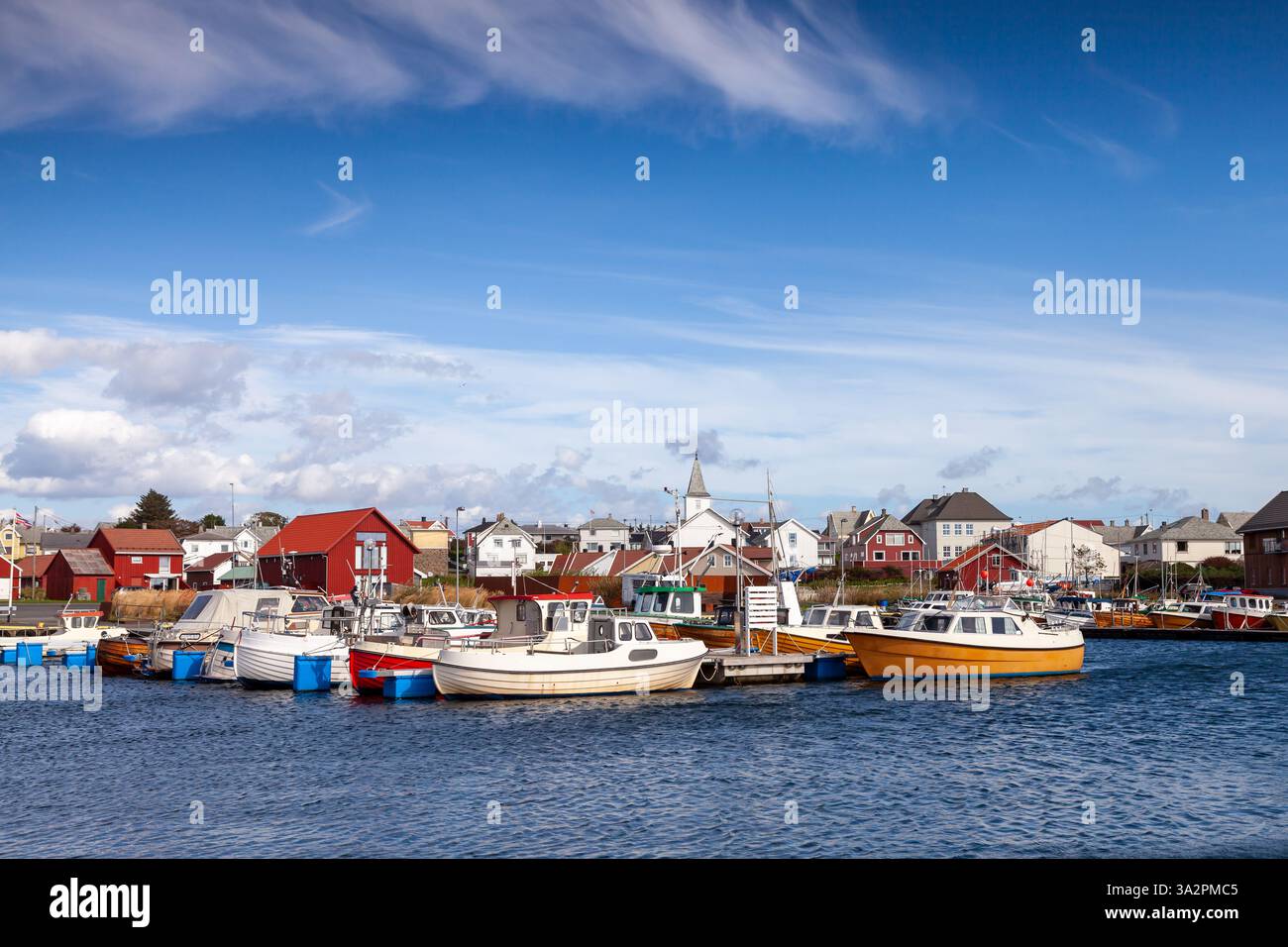 A Norwegian harbor scene in Borhaug, Lista, featuring a dock lined with ...